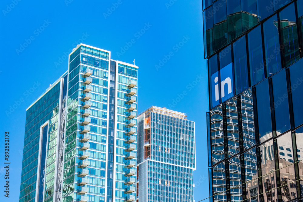 LinkedIn sign and logo on glass facade of professional networking ...