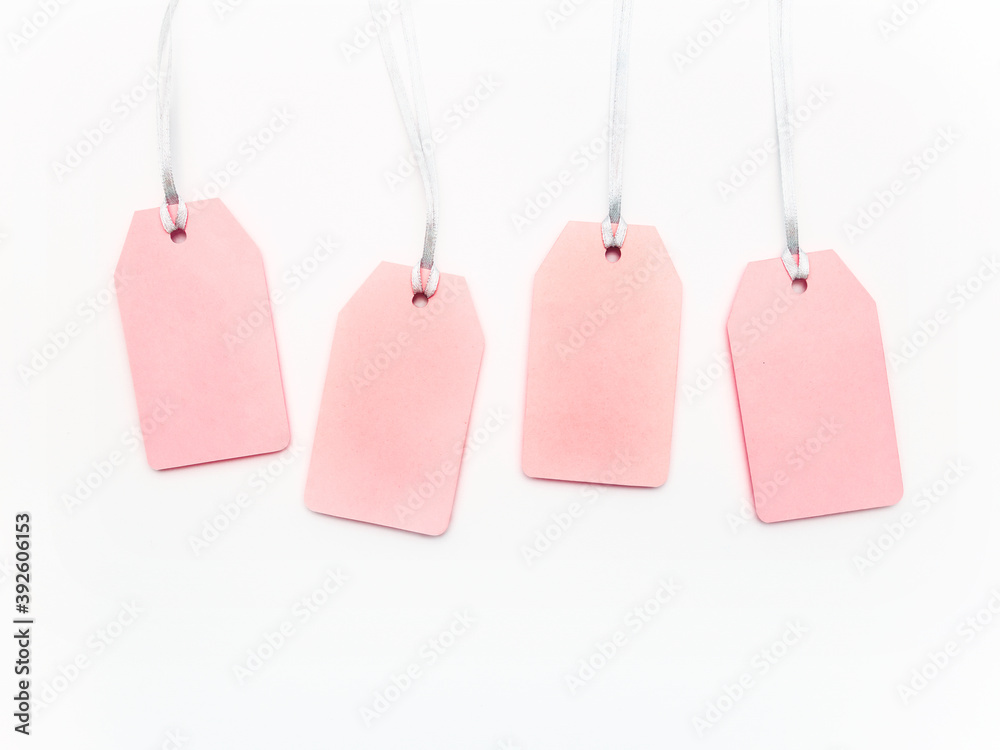 Four pink clear tags on white background. Glamorous labels on silver ...
