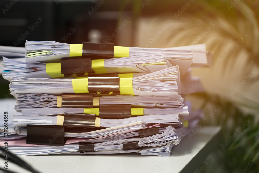 Piles of stack unfinished documents reports files with overwork ...
