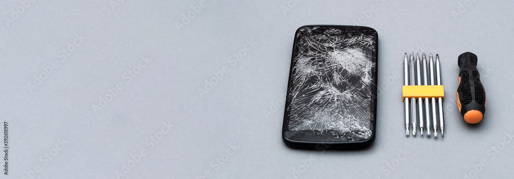 tools for phone repair, touch screen change. mobile phone with broken ...