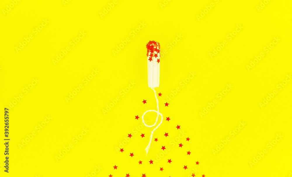 Women's tampons with red glitter stars on a bright yellow background ...