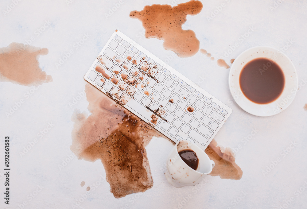 poured a cup of coffee onto the keyboard. White background. bad case ...
