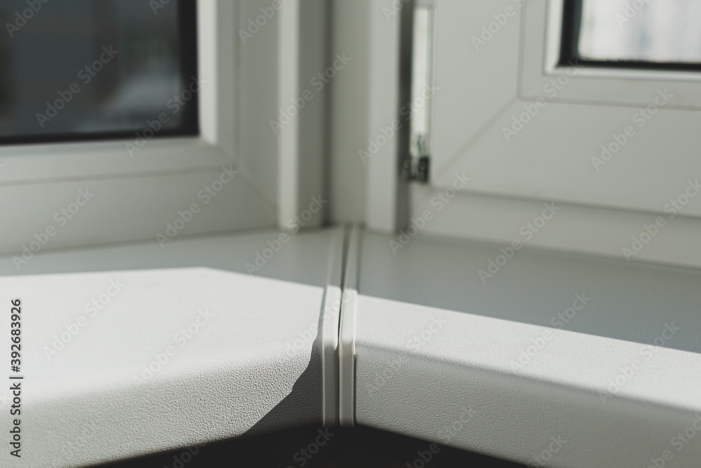 Joint of two window sills of a new plastic frame Stock Photo | Adobe Stock