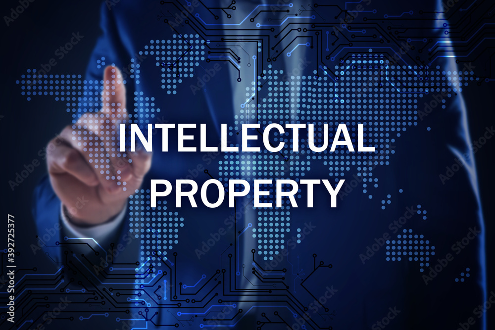 Intellectual property concept. Man using virtual screen with world map ...