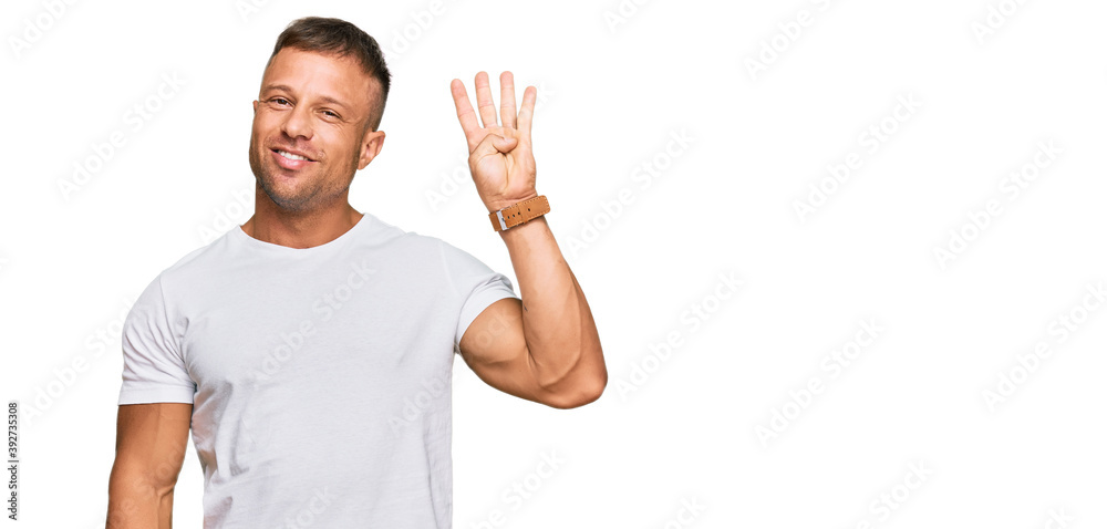 Handsome muscle man wearing casual white tshirt showing and pointing up ...