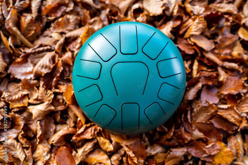 Handpan steel tongue drum relaxing musical instrument placed in the ...