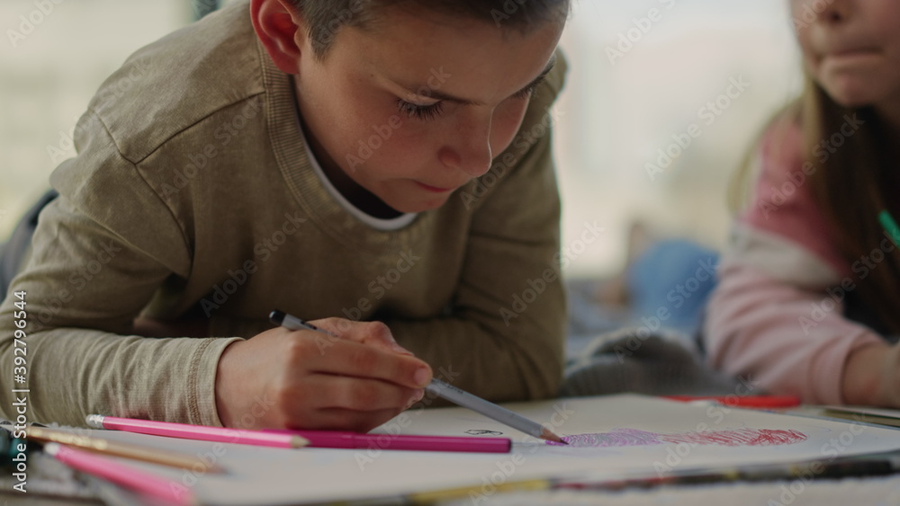 Cute children doing arts indoors. Boy and girl drawing at home. Stock ...