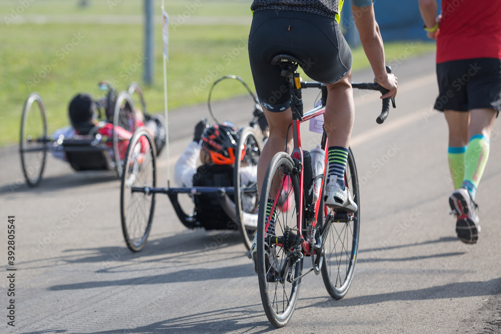 Disabled Athletes training with their Hand Bike with Cyclist and ...