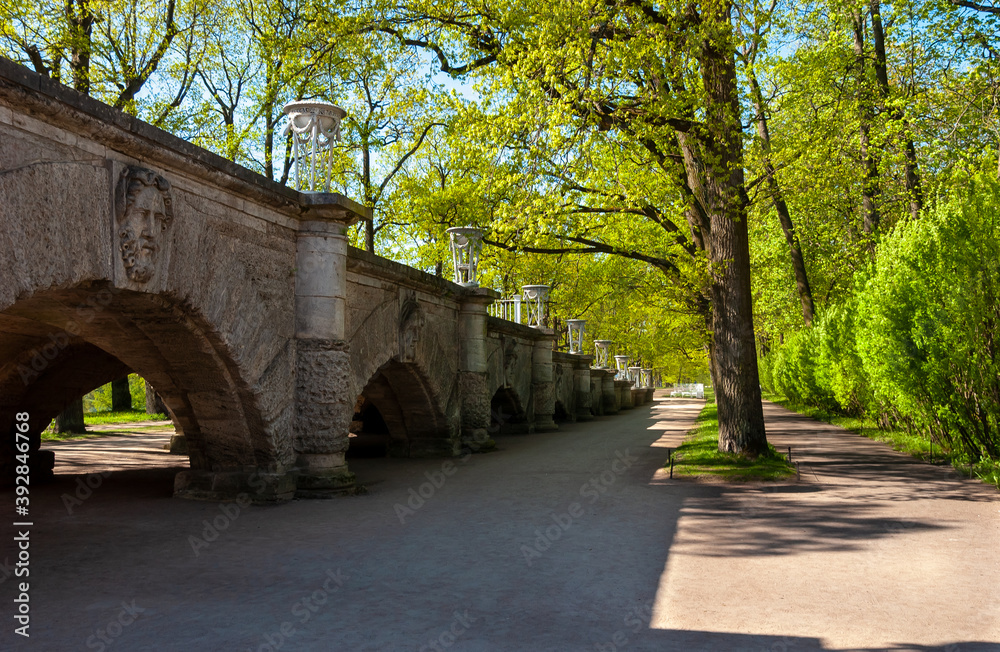 Stone inclined ramp with sculpture and flower vases. Leads to the park ...