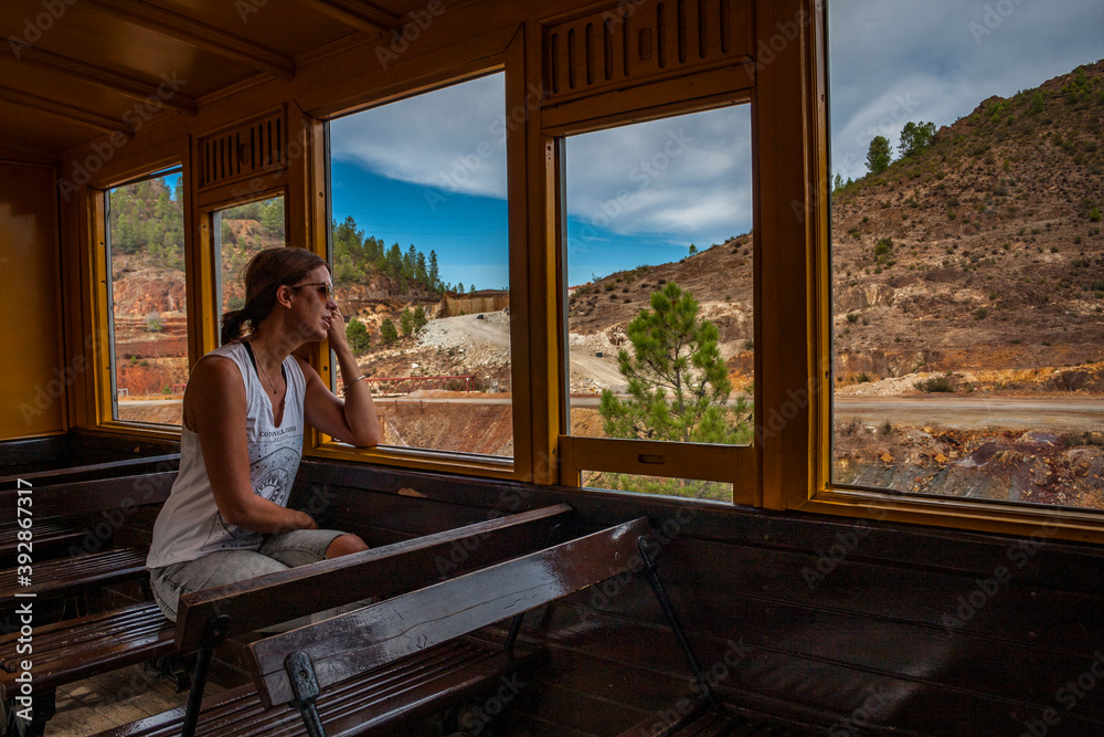 young girl looking longingly out the window of a train Stock Photo ...