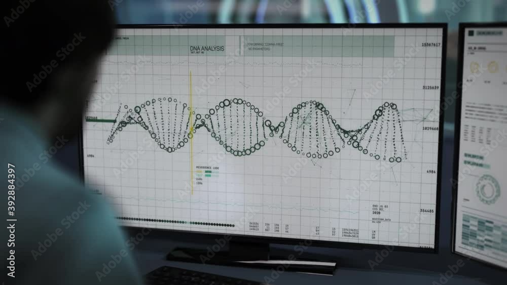 A doctor is standing behind the computer screen. Investigating the ...