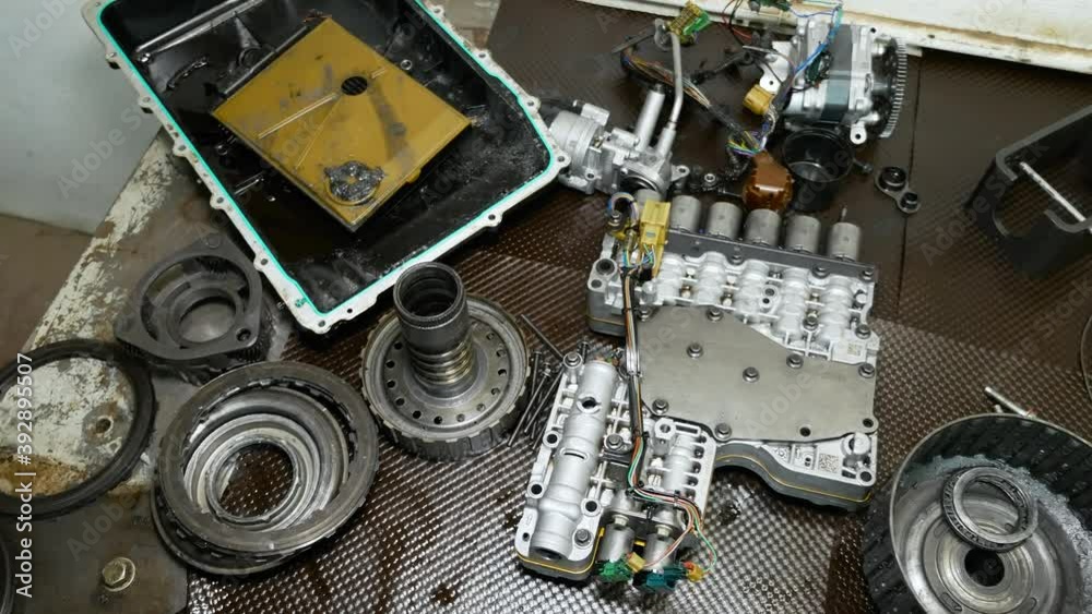 A top down view of a mechanics workbench showcasing parts of a ...