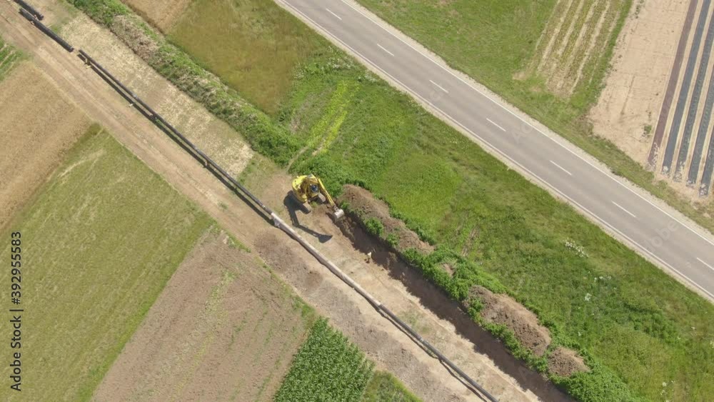 Video Stock AERIAL, TOP DOWN: Heavy duty excavator digs up large ...