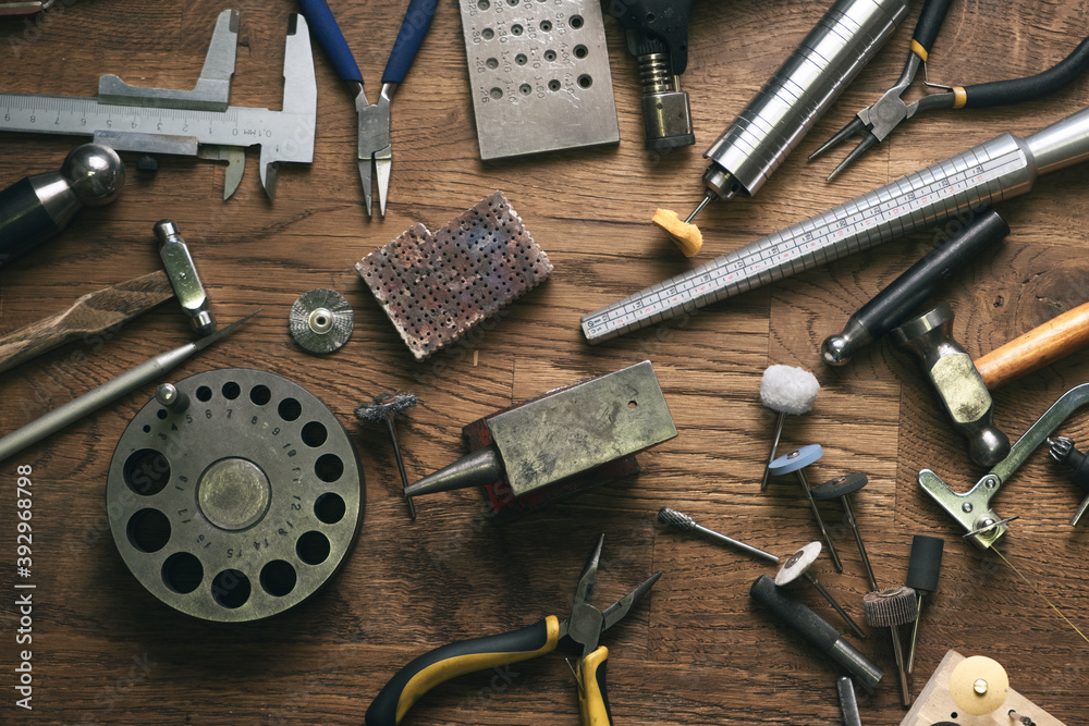 Top view jewelry maker workbench with tools on table. Equipment and ...