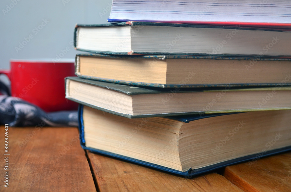 A stack of old books with yellowed pages, textbook, training ...