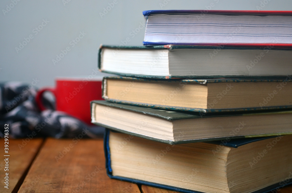 A stack of old books with yellowed pages, textbook, training ...