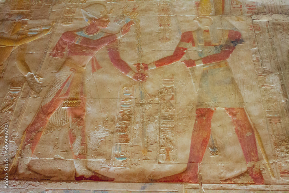 Hieroglyphics on the walls of temples of Egypt of a disciple making ...