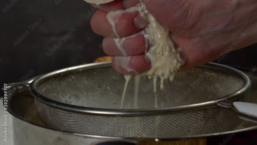Video „The chef squeezes soy milk from soybeans through a linen gauze ...