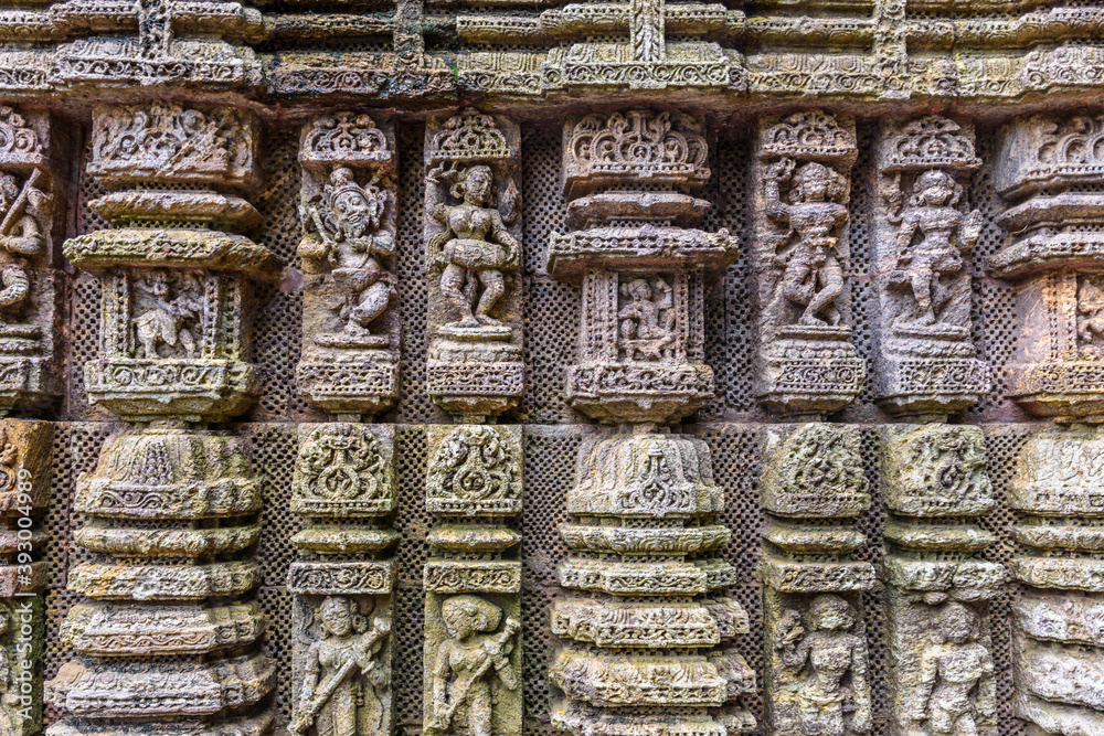 Ancient sandstone carvings on the walls of the ancient sun temple at ...
