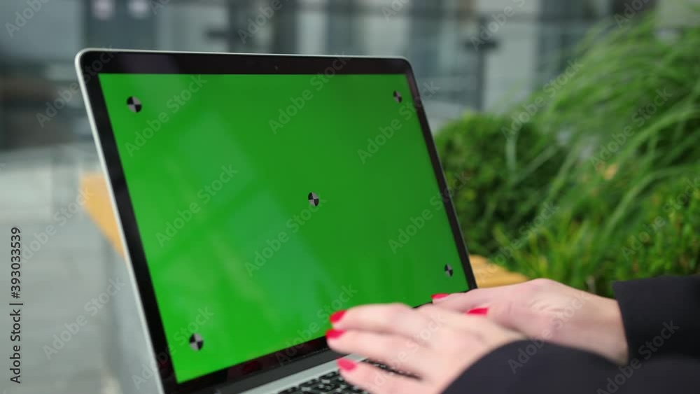 New technology concept. Young woman with red nails typing on the ...