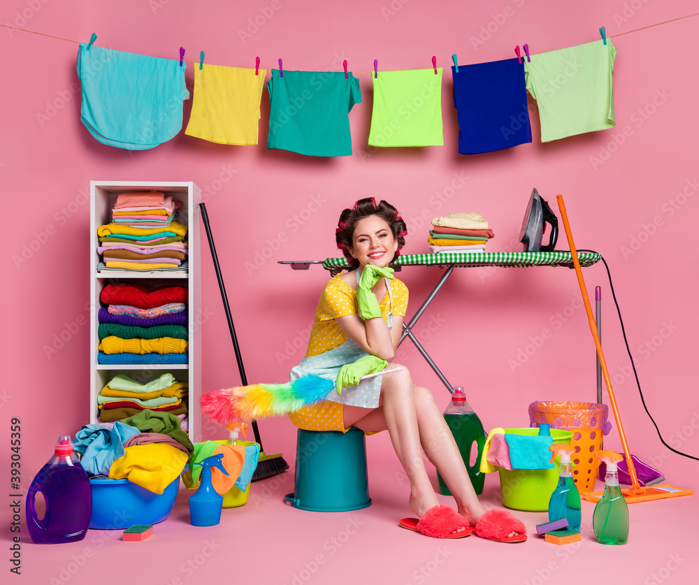 Full body view of pretty cheerful glad housemaid sitting on bucket ...