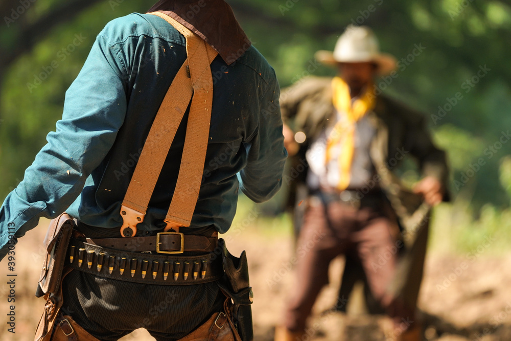 Cowboy life. Shooting pistols in action shooting competition. Battle ...