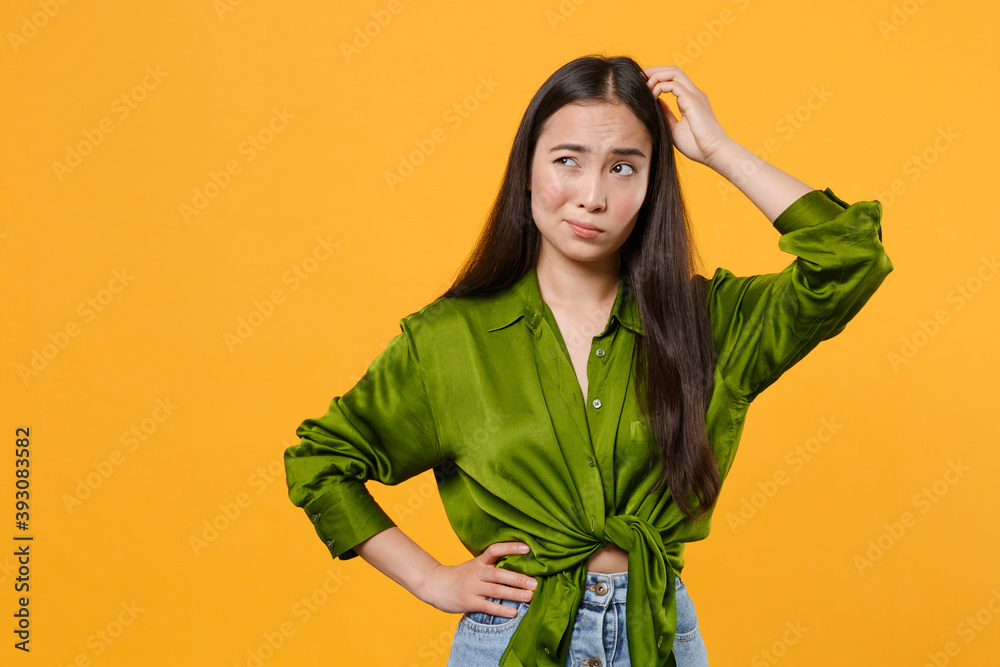 Preoccupied confused puzzled concerned young brunette asian woman 20s ...