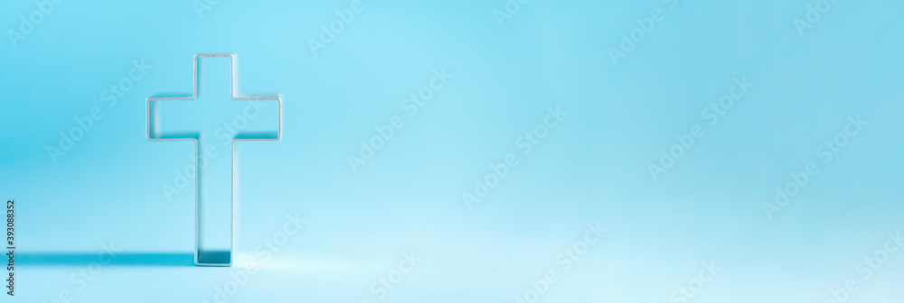 Christian cross on blue background with soft bokeh lights background ...