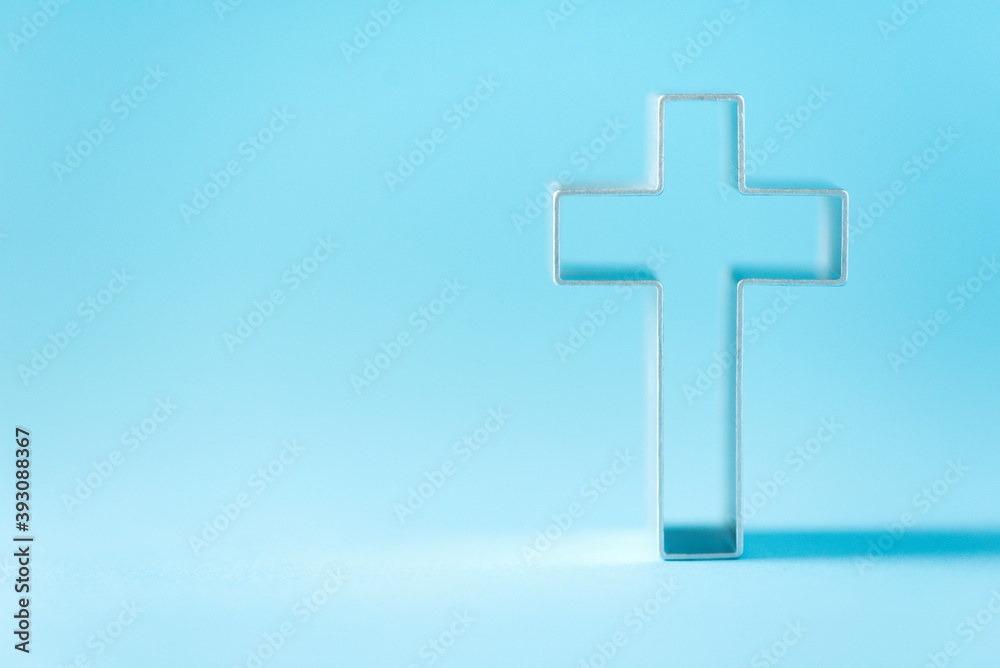Christian cross on blue background with soft bokeh lights background ...