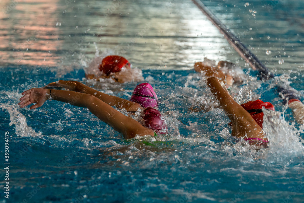 Triathlon swimming. Triathletes training at the pool doing open water ...