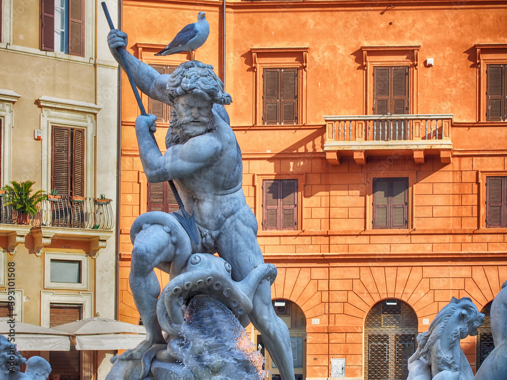 Statue of Neptune fighting with an octopus on the Fountain of Neptune ...