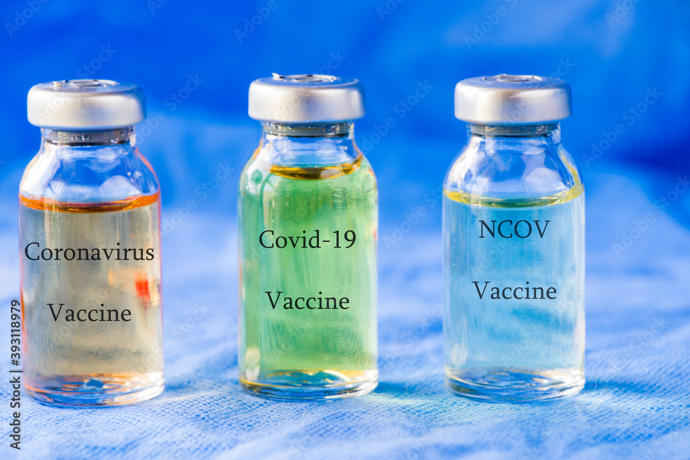 Corona virus and Covid - 19 new vaccine in ampules, different color ...