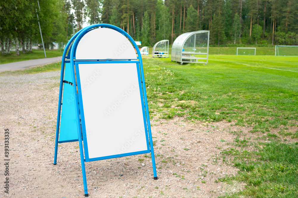 empty blue stand in metal frame for advertising information on sport ...