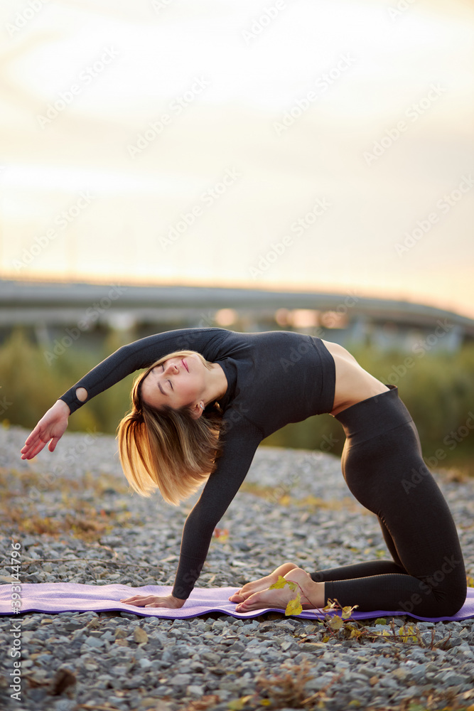 flexible young woman is going to do Bridge Pose, Urdhva Dhanurasana ...