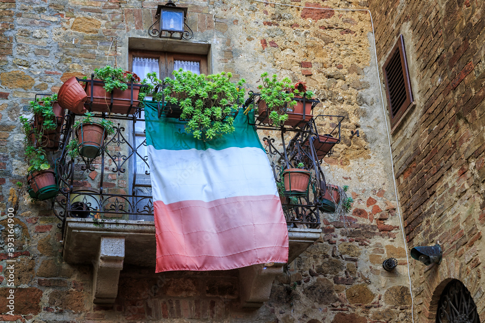Italian flag hanging on balcony Stock Photo | Adobe Stock