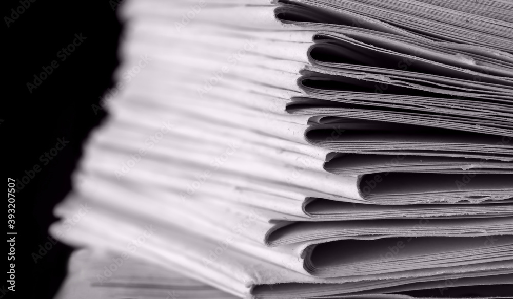 bundles bales of paper documents. stacks packs pile on the desk in the ...