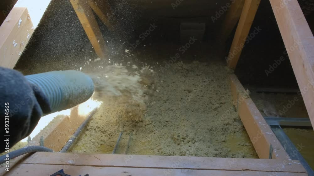 Medium shot of thermal insulation of house with mineral wool in ...