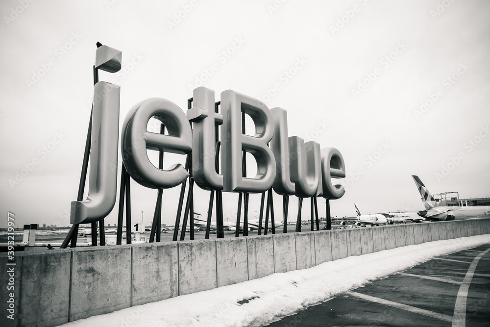 jetBlue sign displayed near the entrance to the jetBlue terminal of the ...