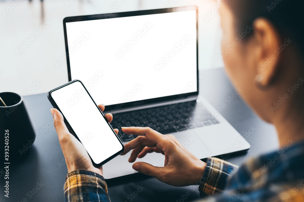 computer,cell phone blank screen mockup.hand woman work using laptop ...