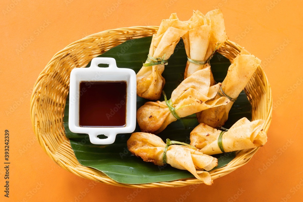 Thai traditional spring rolls or toong tong, exotic light meal served ...