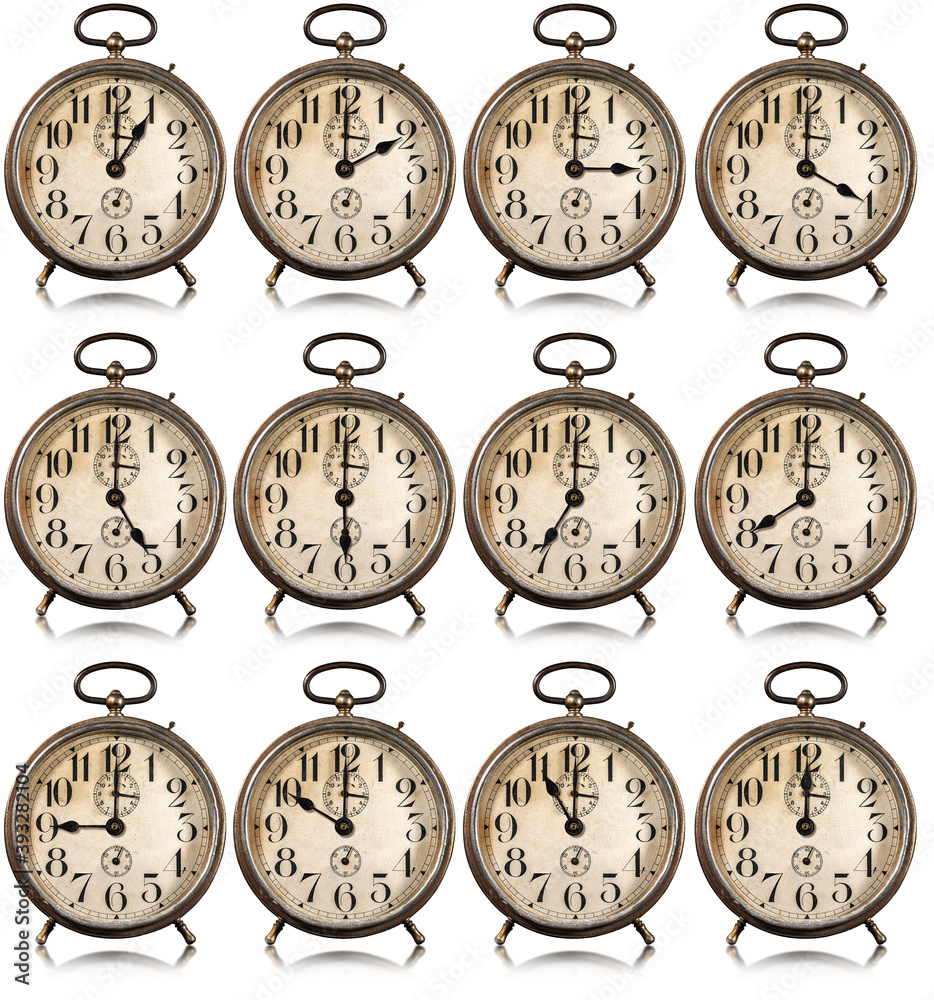 Collection of twelve old alarm clocks with all hours of the day ...