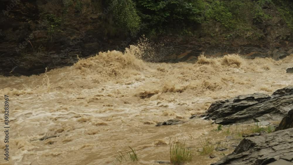 Raging river with dirty water. Dirty water stream, weather cataclysm ...