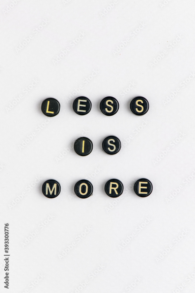 LESS IS MORE beads word typography Stock Photo | Adobe Stock