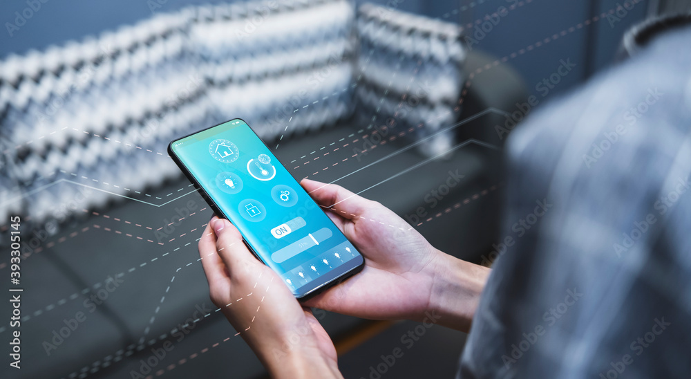 Smart home modern technology Asian girl sitting living room using ...