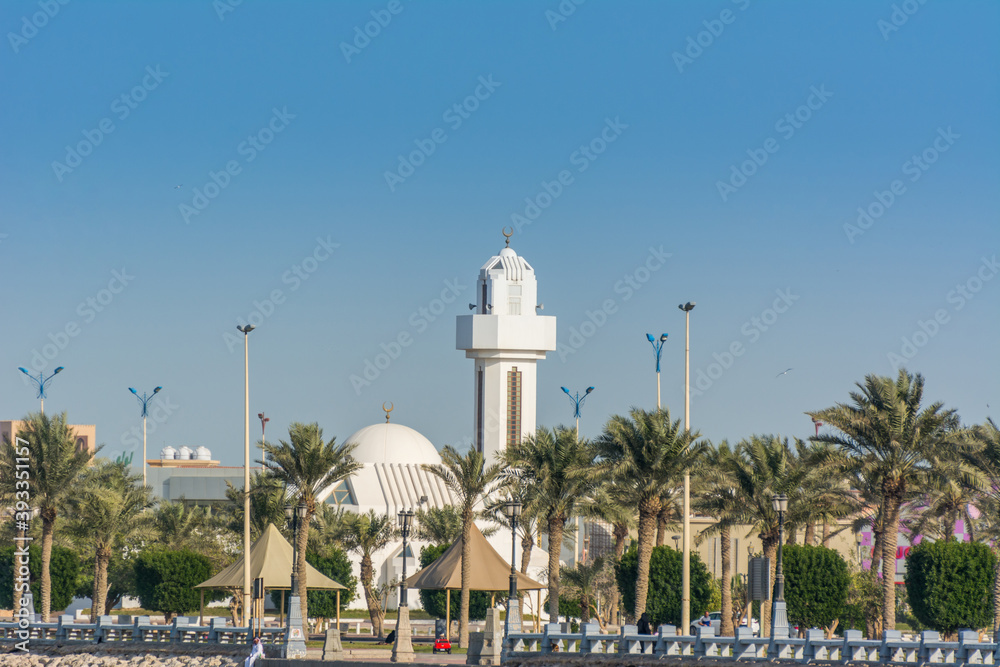 A common small mosque, Al Essa and Al Dowayan Mosque, with palm tree in ...