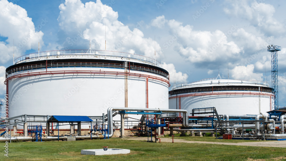 Oil depot storage tanks. Large white Industrial tanks for petrol and ...
