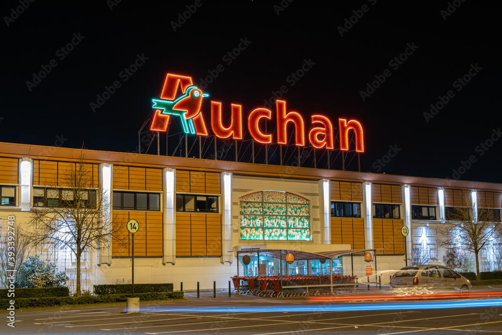 Roncq,FRANCE-February 27,2019: Night view of Auchan supermarket logo ...