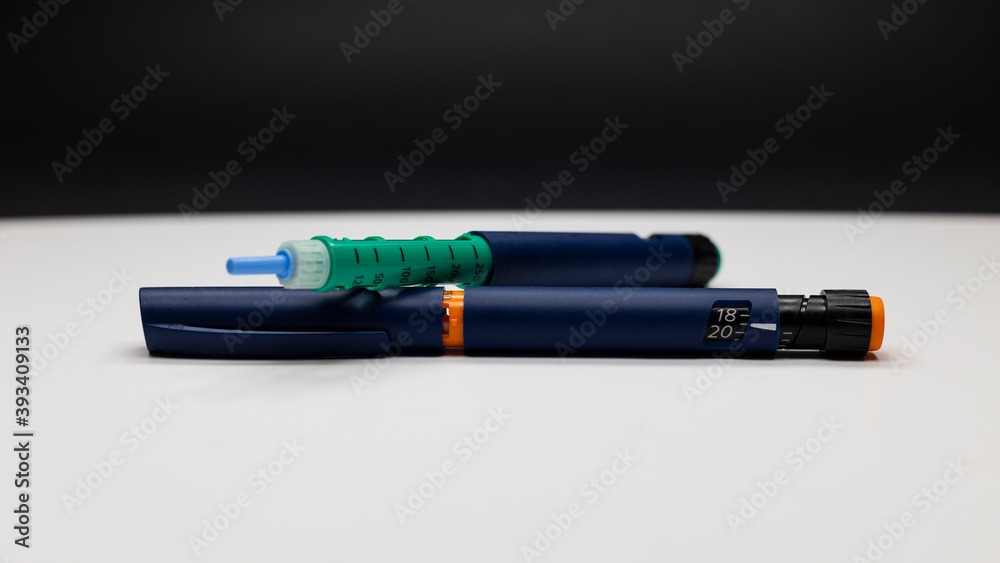 Insulin pens on black and white background. Insulin pens for hormone ...