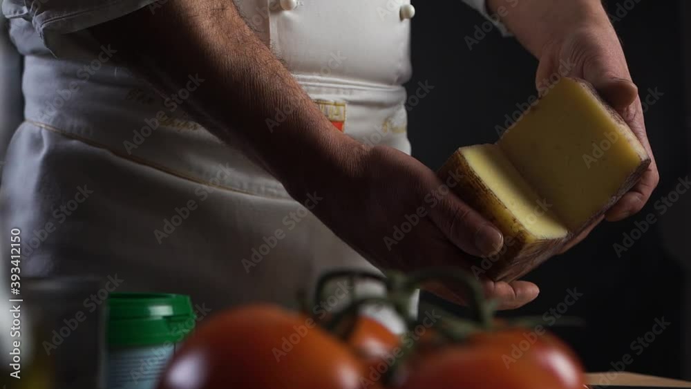 close-up shot man chef culinary specialist white coat and apron holds ...