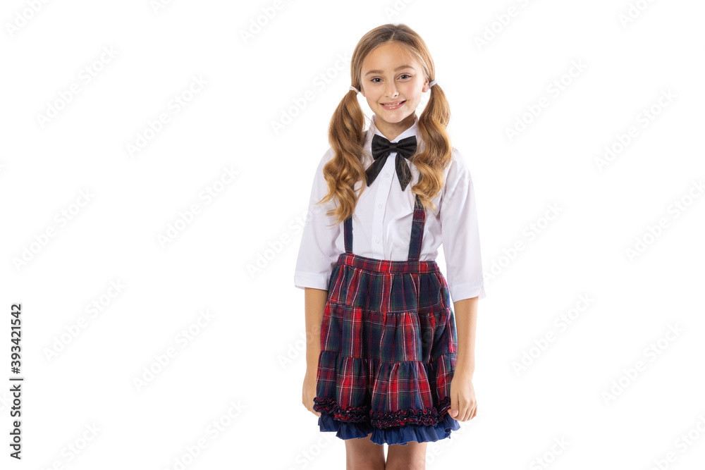 Schoolgirl girl in uniform isolated on white background. Stock Photo ...
